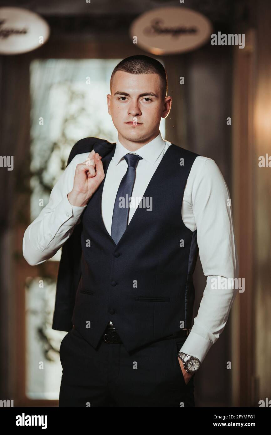 Vertical shot of a handsome Bosnian Caucasian man wearing a suit ...
