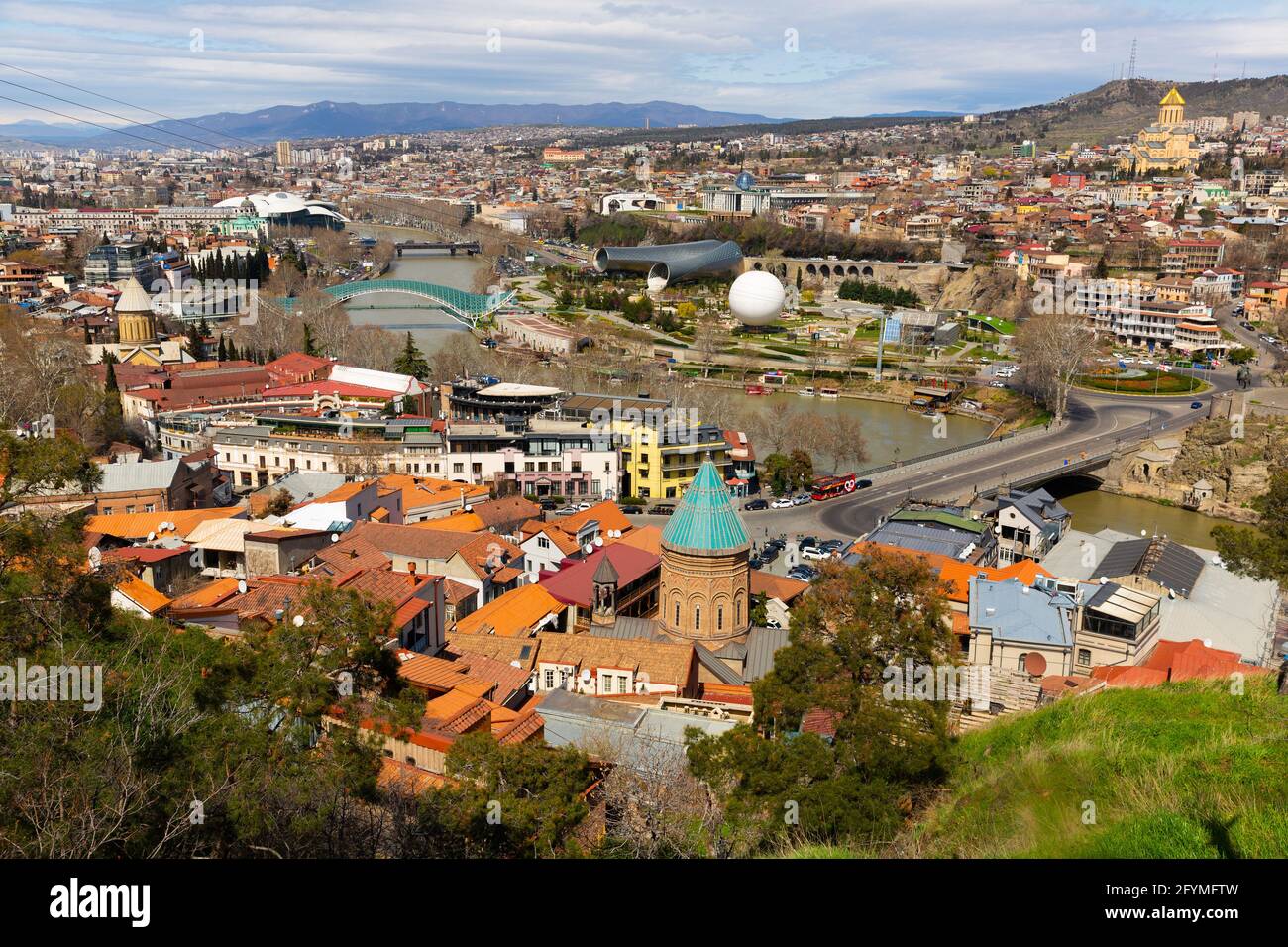 Spring cityscape of historical area of Tbilisi with view of modern bow ...