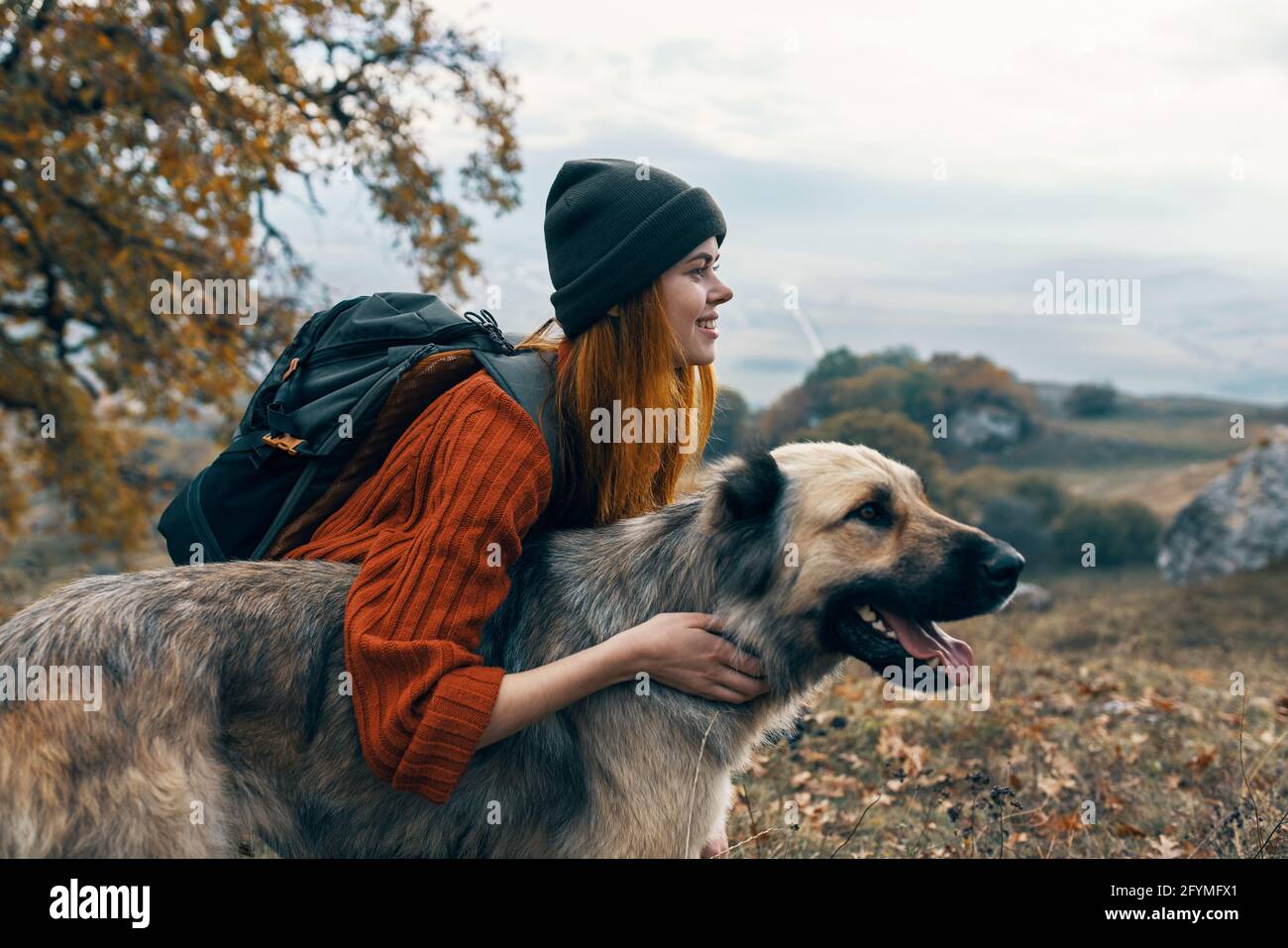 hiker in nature with dog travel friendship landscape Stock Photo - Alamy