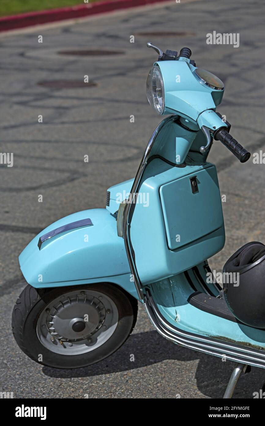 Light blue electric scooter parked in the parking Stock Photo - Alamy