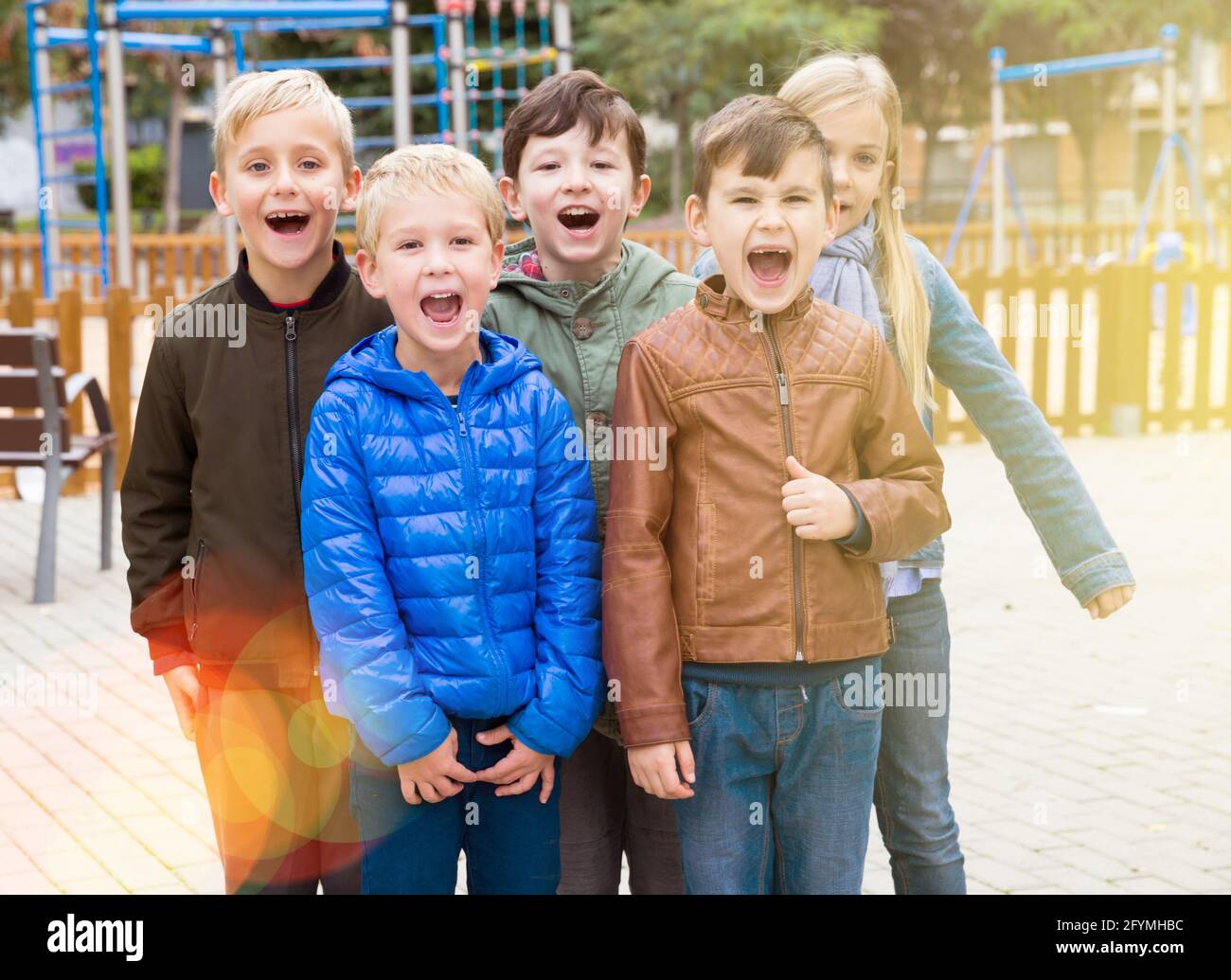 Five little friends posing on the playground Stock Photo - Alamy