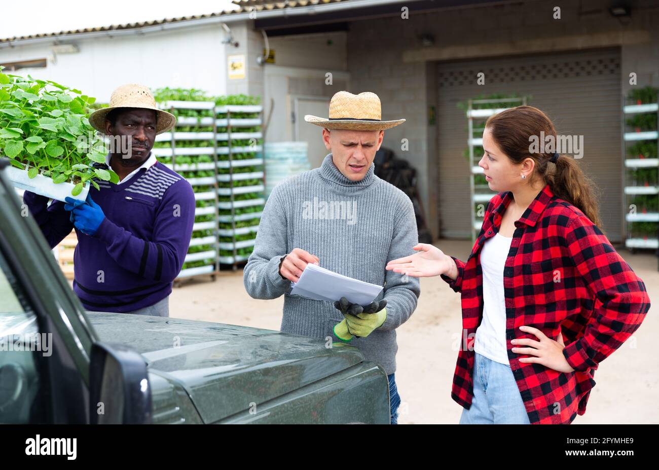 Three irritated farmers berating outside at plant nursery, having work ...