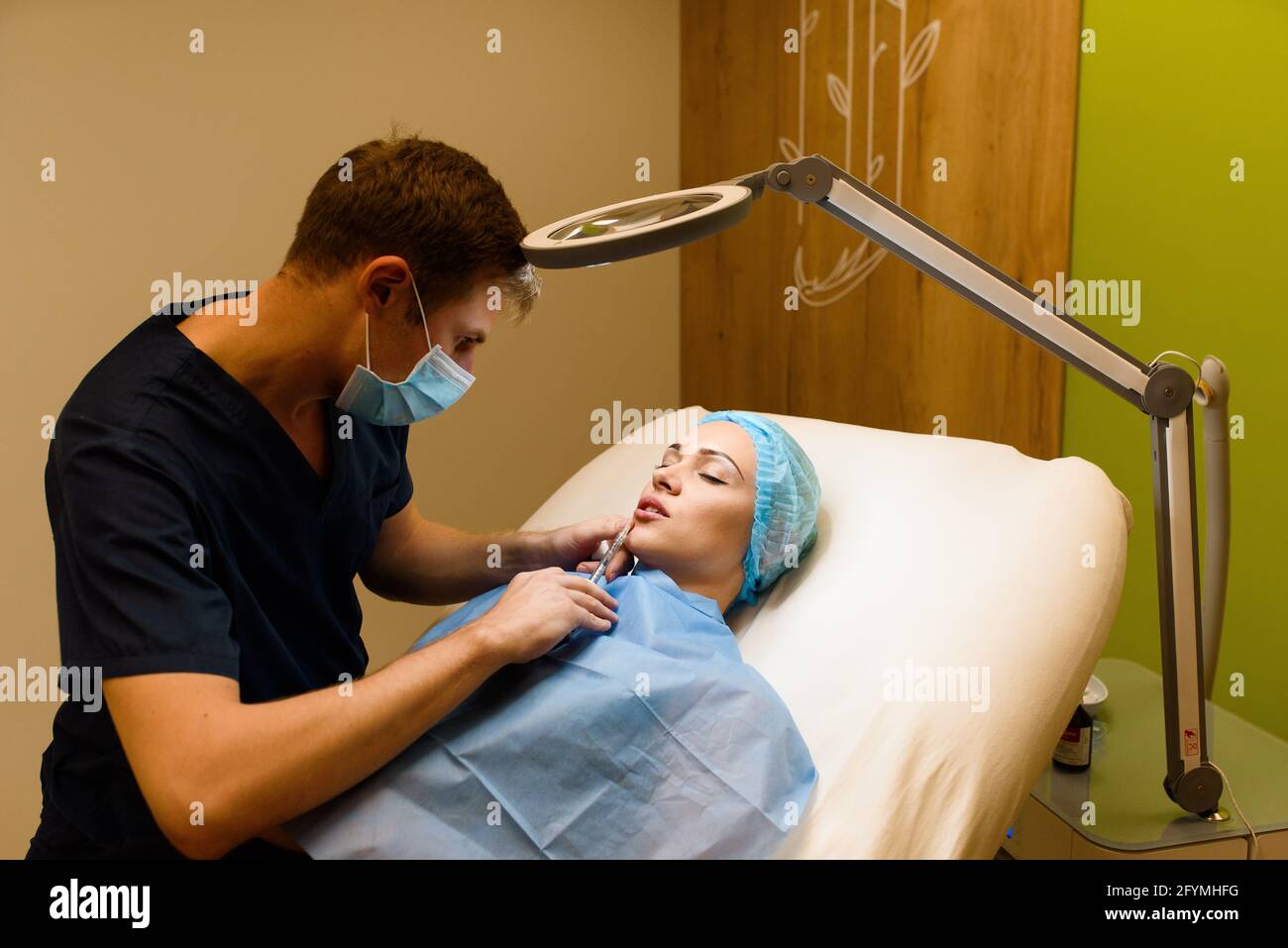 Woman makes rejuvenating facial injections procedure for lips ...