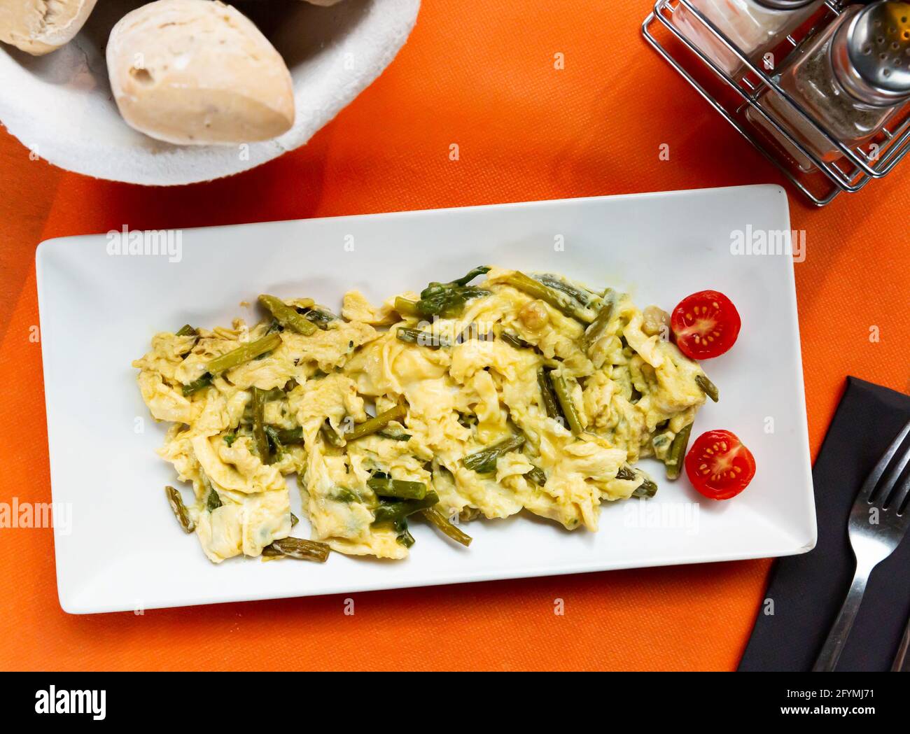 Traditional Spanish revoltillo - scrambled eggs with garlic, shrimp and ...