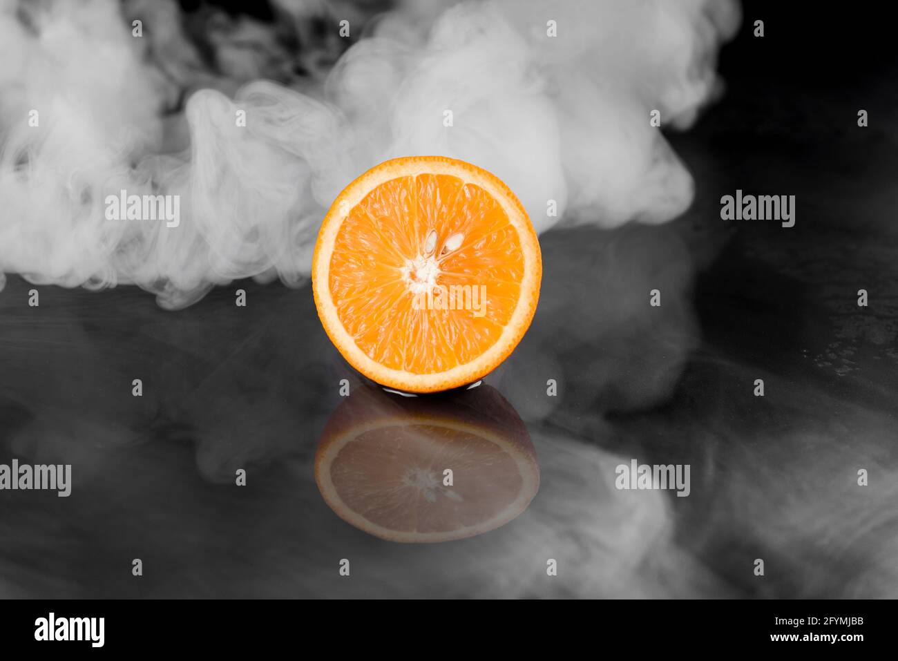 Orange with smoke on black background. Citrus fruit with white smoke of ...