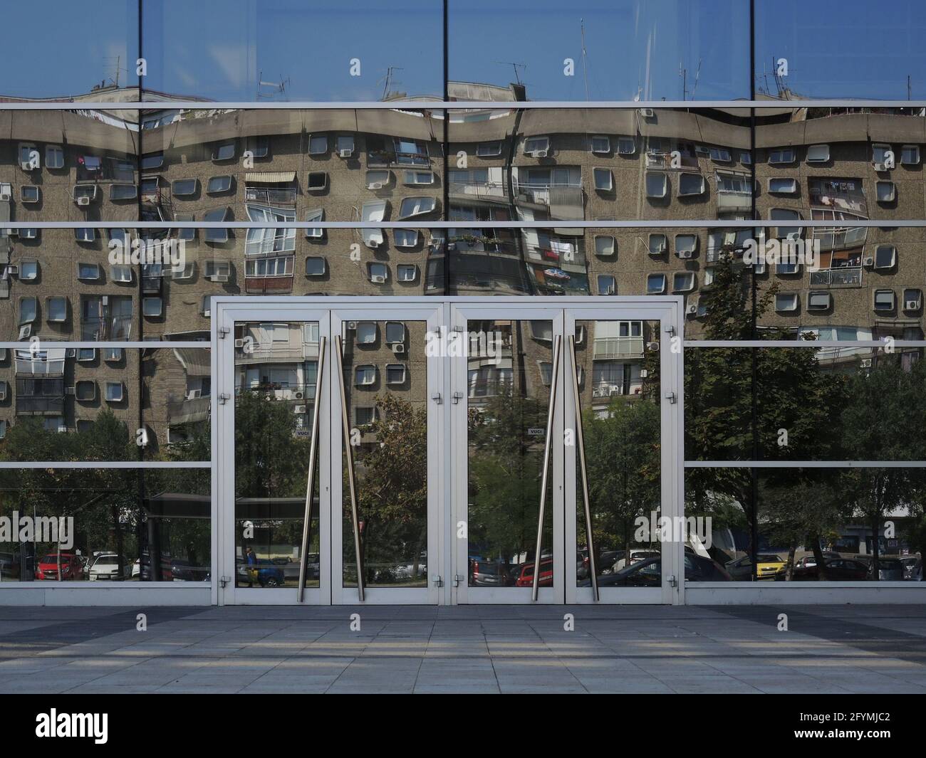 Reflection of a building in the full glass windows of another building ...
