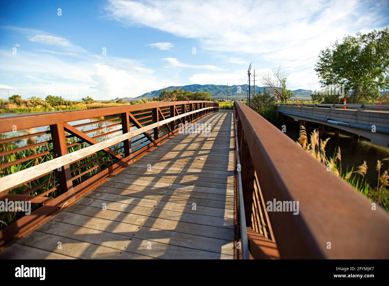 Wooden pedestrian bridges over a river Stock Photo - Alamy
