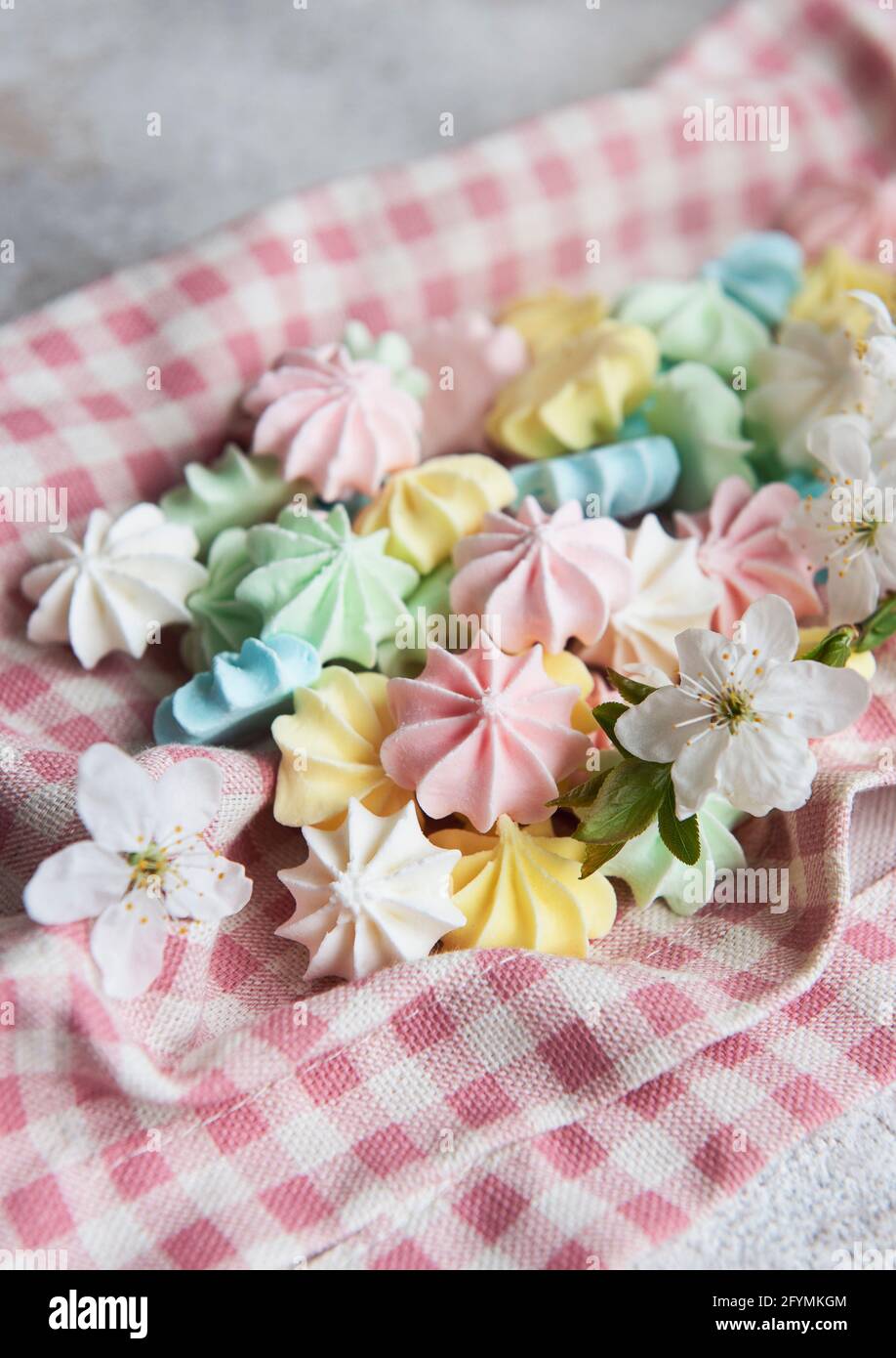 Close-up delicious meringue cookies pastel colors. French pastries ...