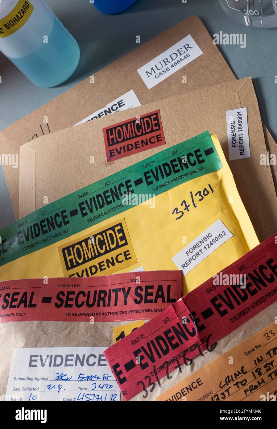 Files and evidence bag in a crime lab, conceptual image Stock Photo - Alamy