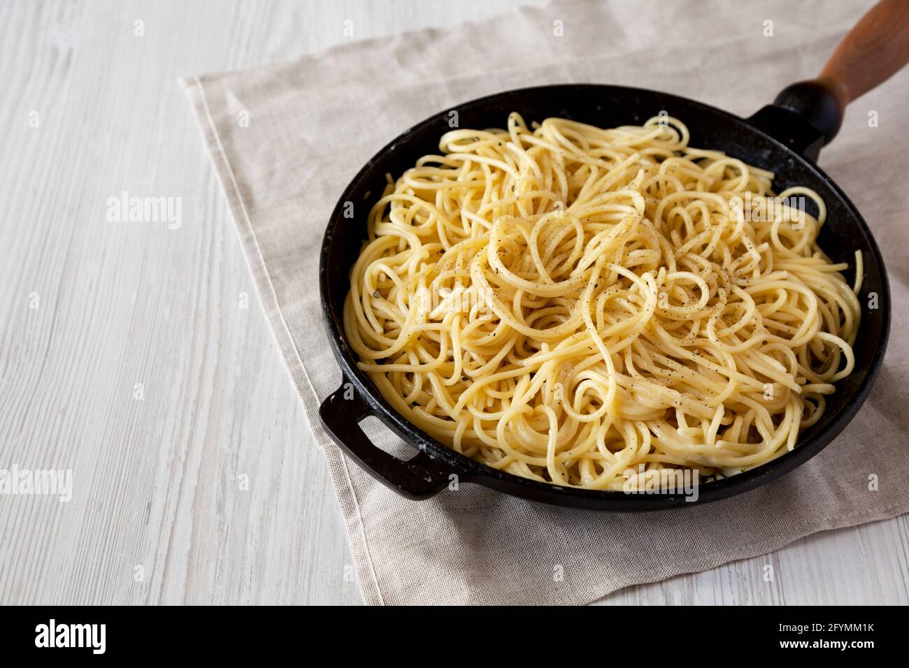 Homemade Cacio E Pepe Pasta with Pecorino Romano and Pepper in a cast ...