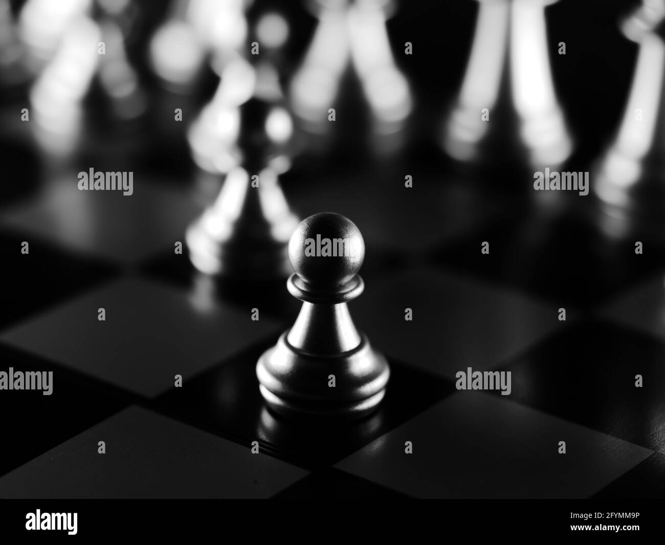 Grayscale shot of chess pieces on a chessboard Stock Photo - Alamy