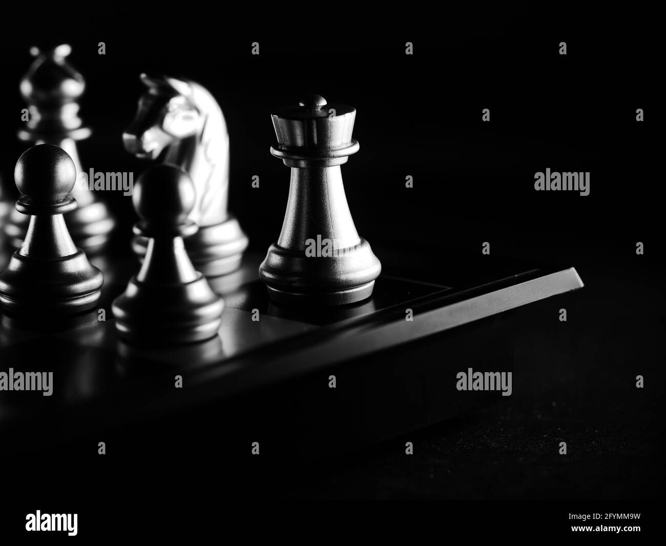 Grayscale shot of chess pieces on a chessboard Stock Photo - Alamy