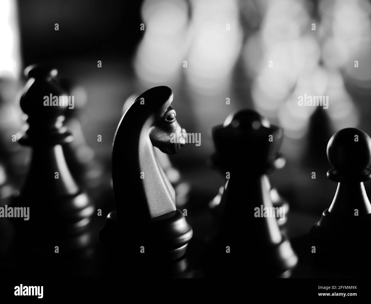 Grayscale shot of chess pieces on a chessboard Stock Photo - Alamy