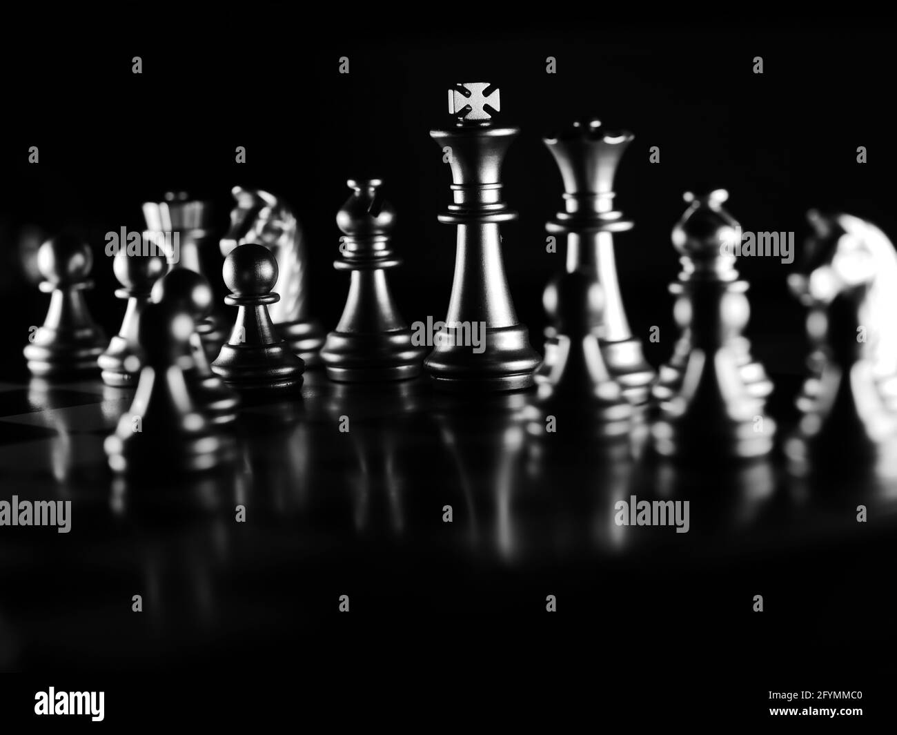Grayscale shot of chess pieces on a chessboard Stock Photo - Alamy