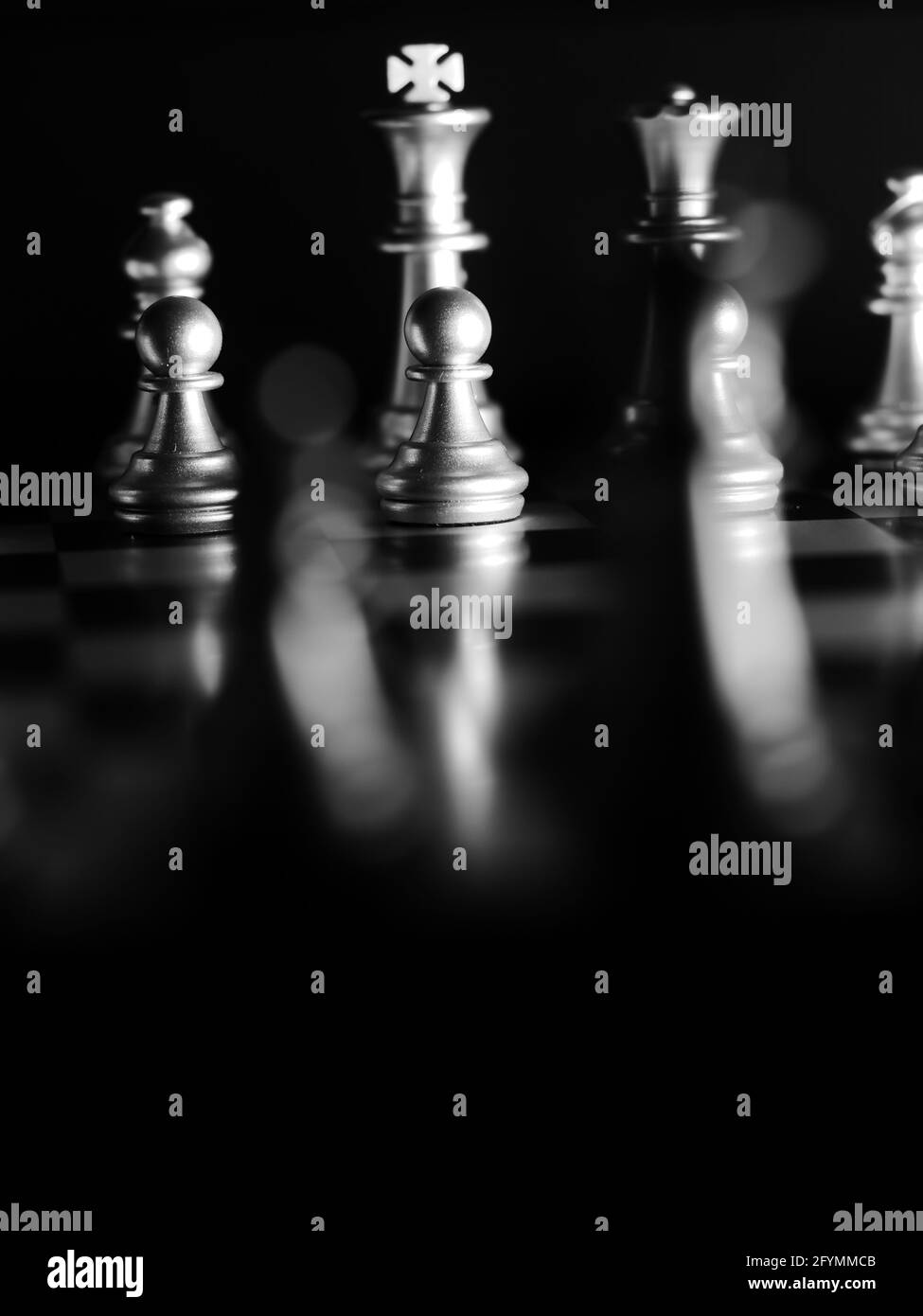 Grayscale shot of chess pieces on a chessboard Stock Photo - Alamy