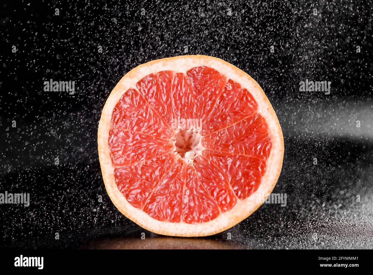 Grapefruit with water drops on black background. Citrus fruit with ...