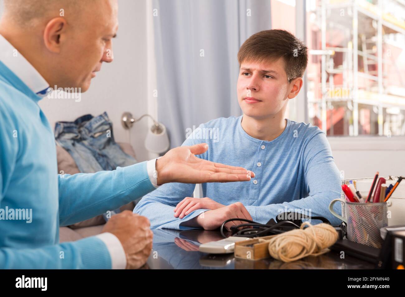 Father lecturing his teenage son at home Stock Photo - Alamy