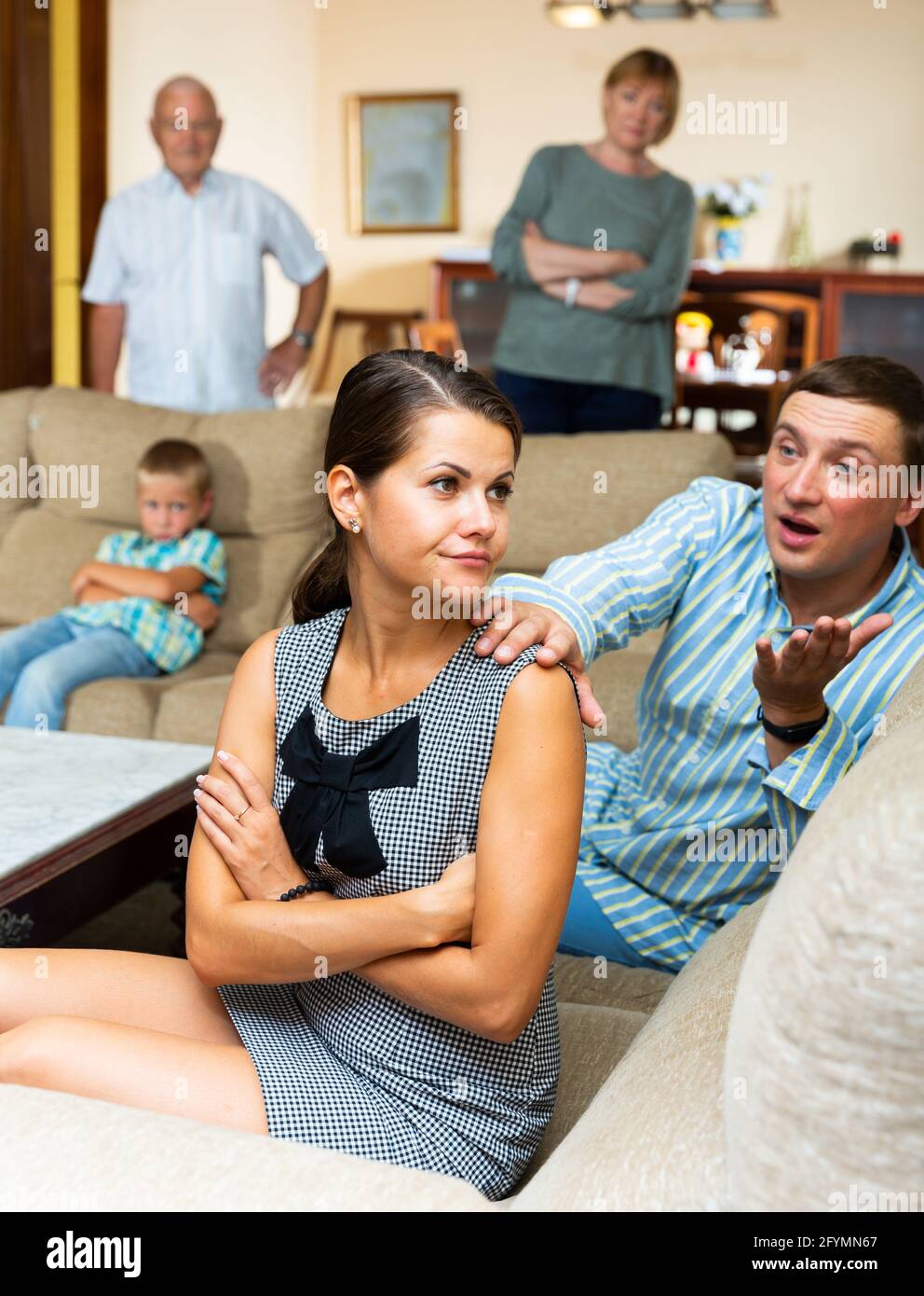 Family of five having quarrel at home Stock Photo - Alamy