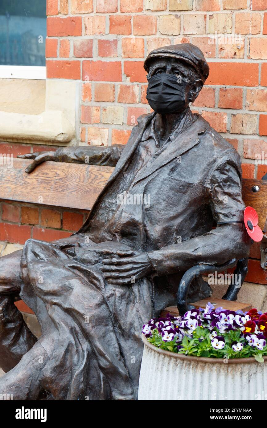 The man on the Bench at Irlam train station Stock Photo - Alamy