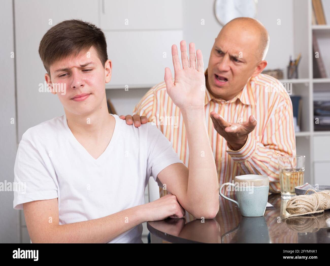 Teenage boy making stop gesture with his hand to scolding father Stock ... Teenage boy making stop gesture with his hand to scolding father Stock ...