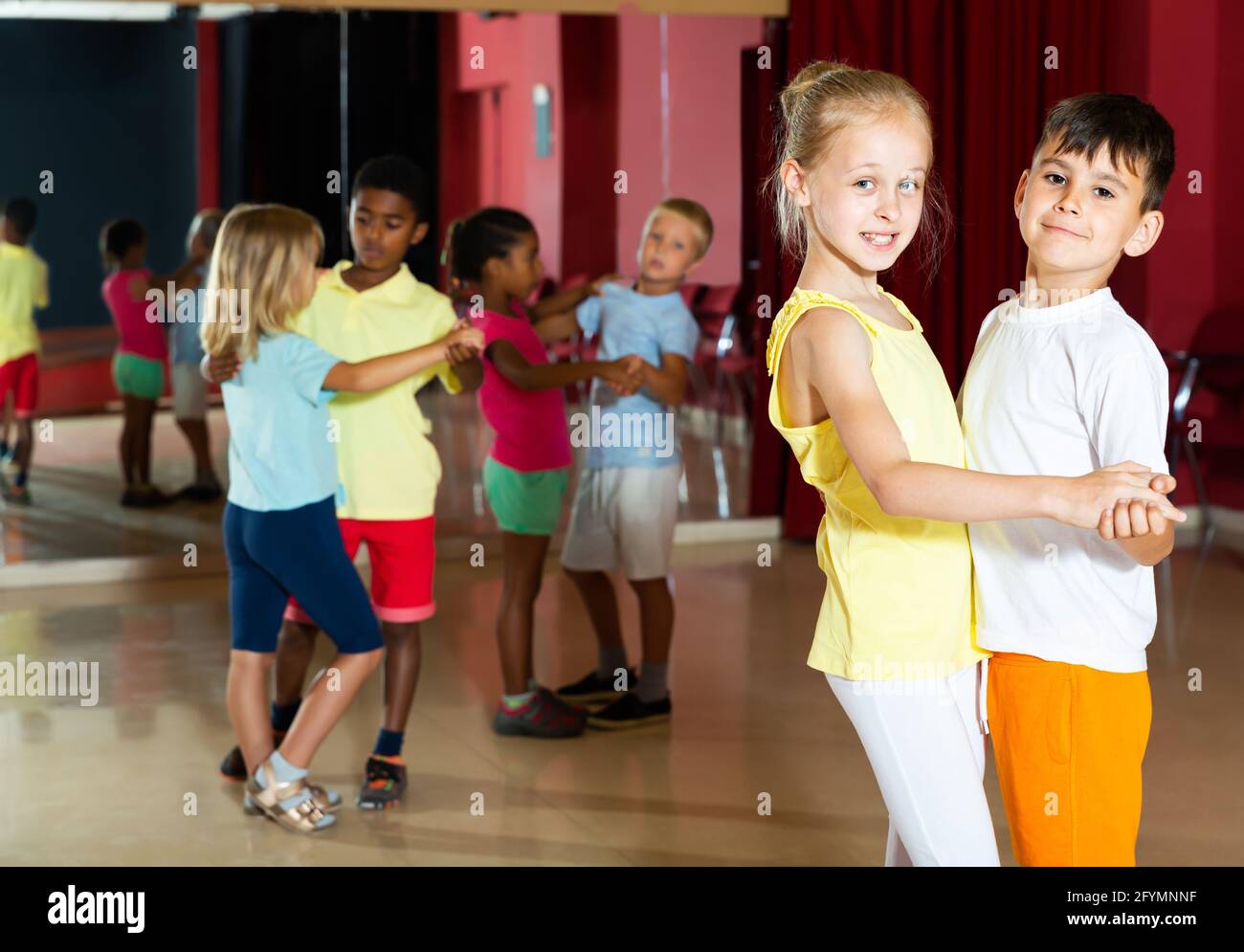 Group of fine children dancing salsa dance in modern studio Stock Photo ...