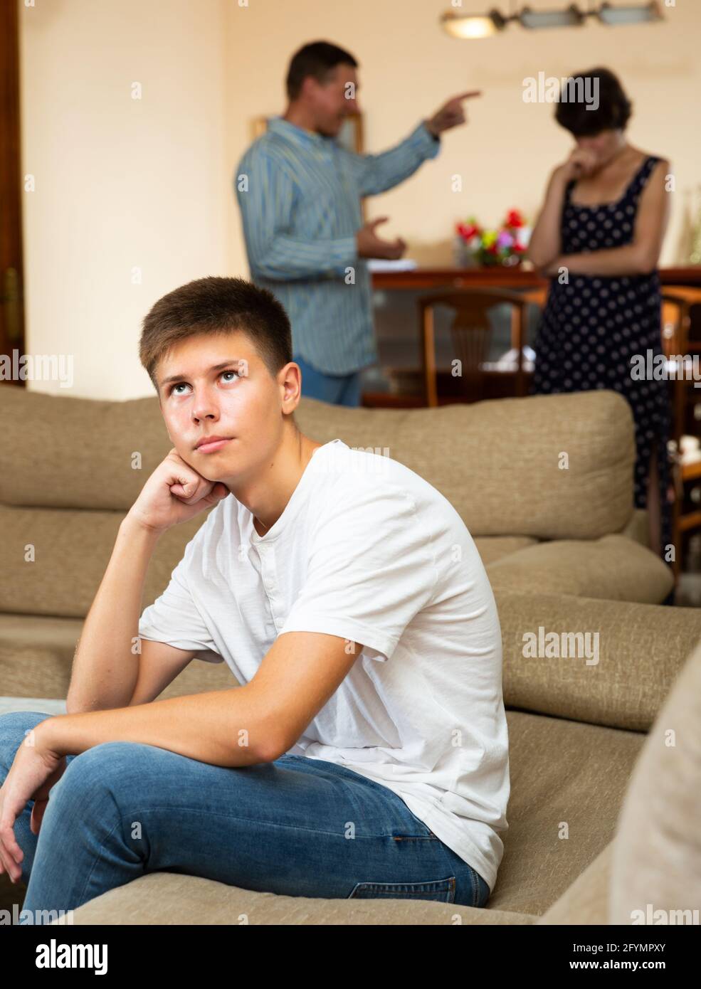 Parents quarrel with teenage son Stock Photo - Alamy