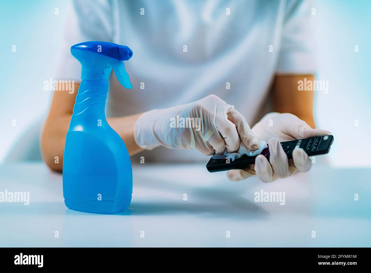 Disinfecting remote controller with alcohol disinfectant Stock Photo ...