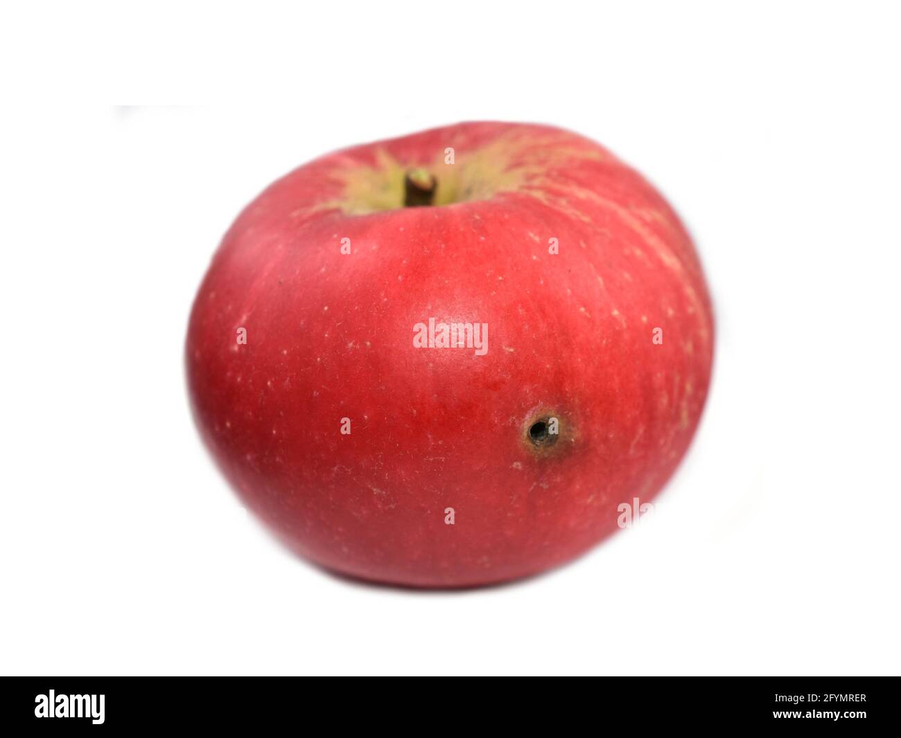 Red apple with big wormhole in it Stock Photo - Alamy