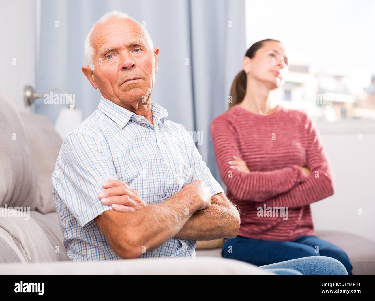 Home quarrel adult daughter and elderly father Stock Photo - Alamy