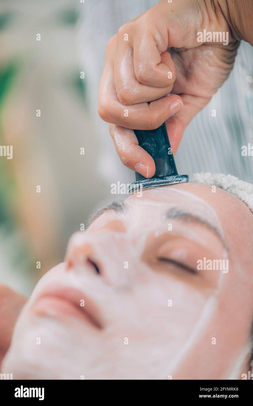 Ventosa cupping facial treatment Stock Photo - Alamy