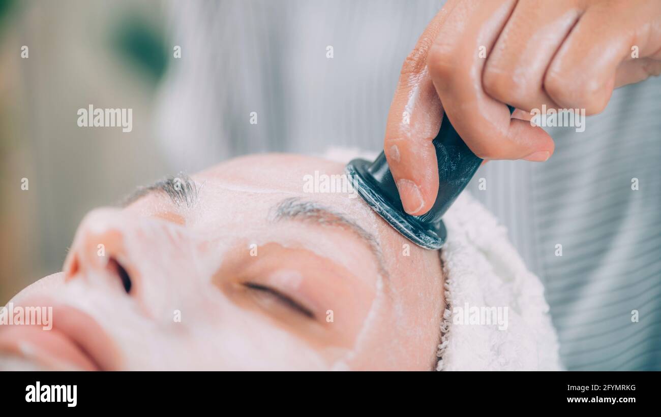 Ventosa cupping facial treatment Stock Photo - Alamy