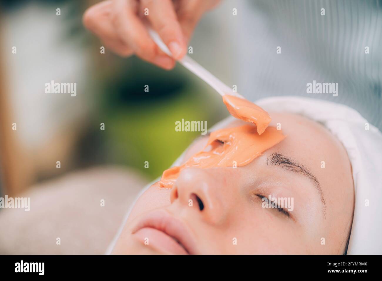Peel off facial mask treatment Stock Photo - Alamy