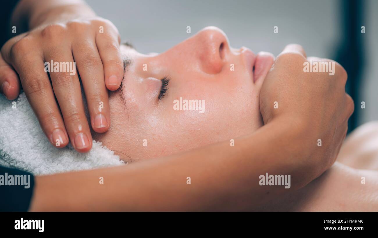 Face lifting massage Stock Photo - Alamy