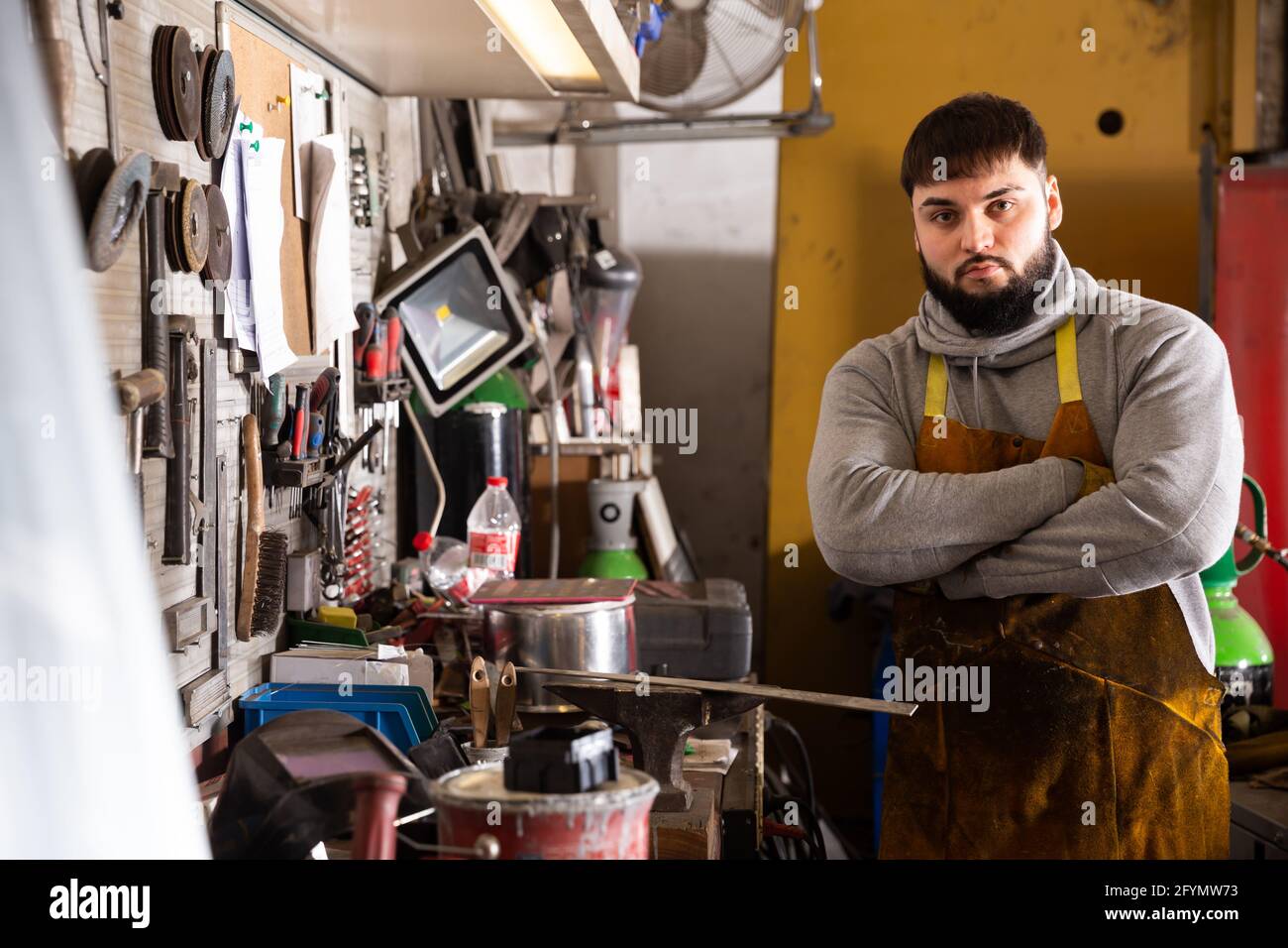 Portrait professional blacksmith in apron hi-res stock photography and ...