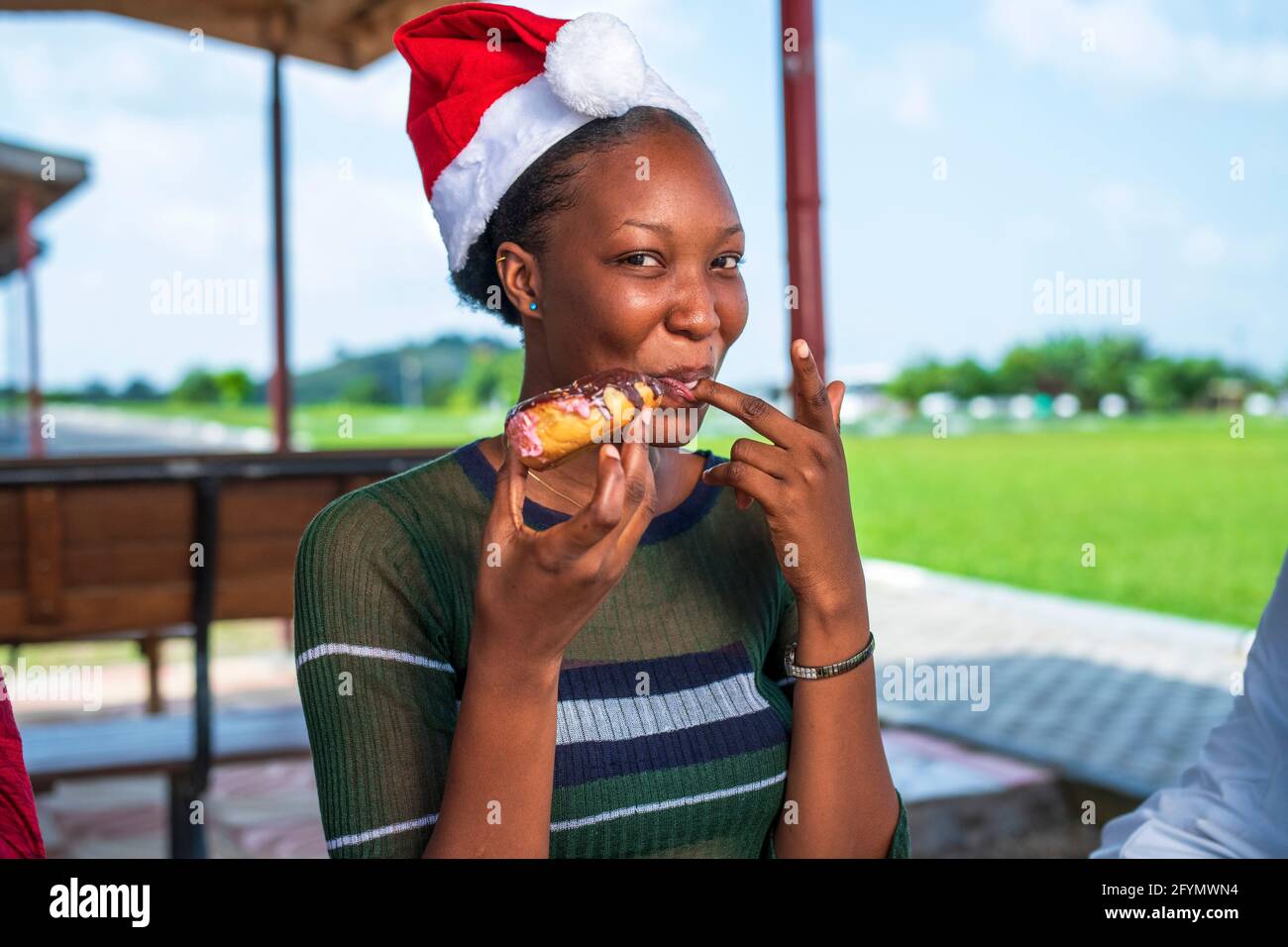 Woman Eating Outside In Hat High Resolution Stock Photography and ...