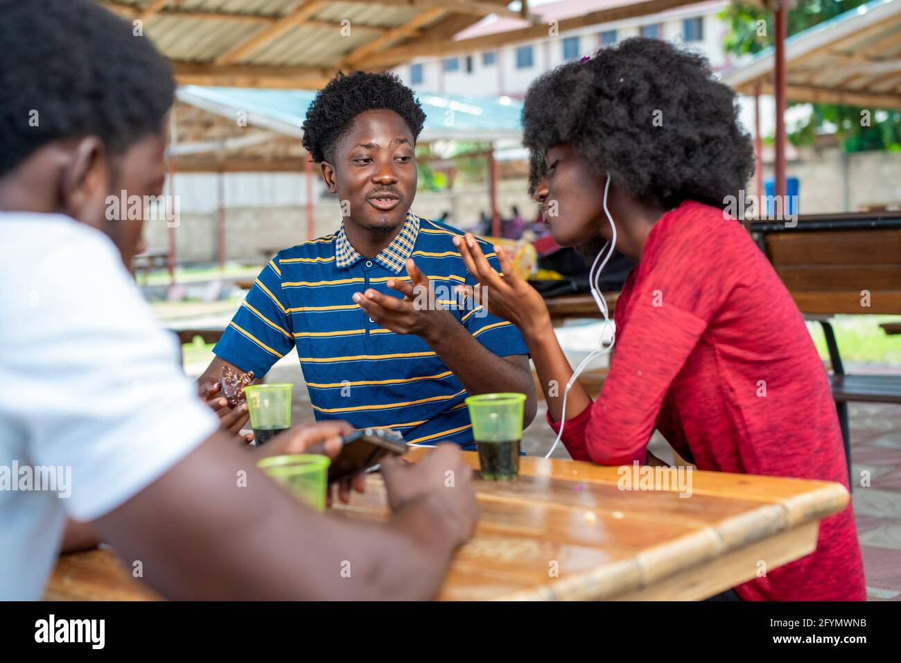Friends in an outdoor cafe Stock Photo - Alamy