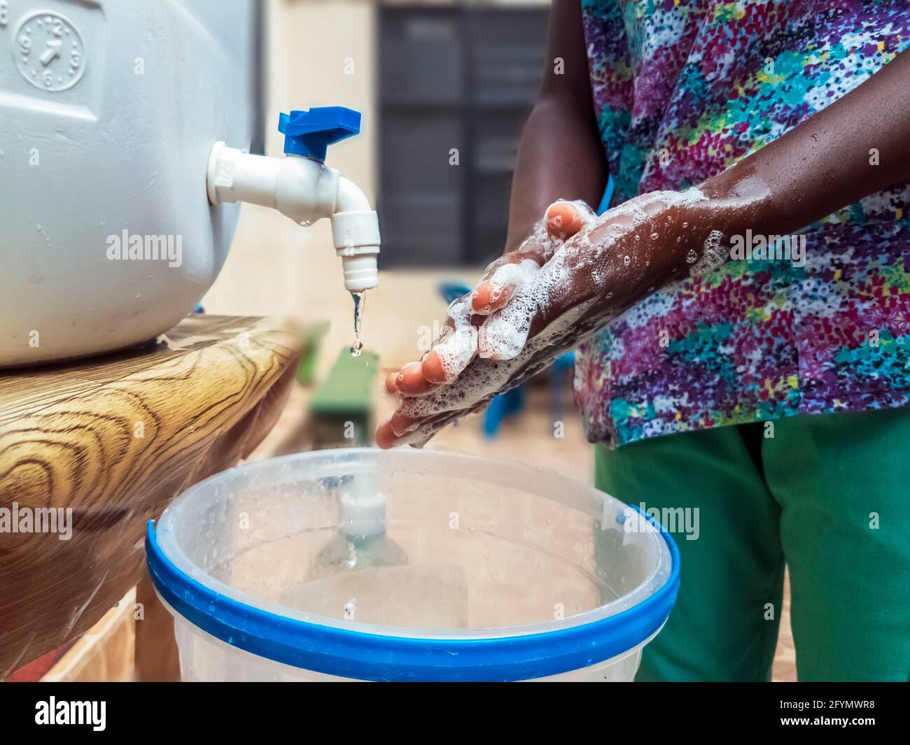 Hand washing african hi-res stock photography and images - Alamy