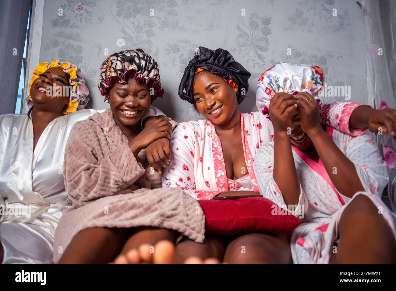 Happy women in dressing gowns and hair bonnets Stock Photo - Alamy