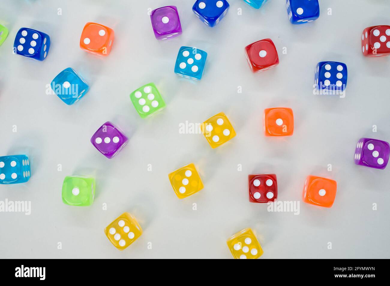 Top view of colorful plastic dice against a gray background Stock Photo ...