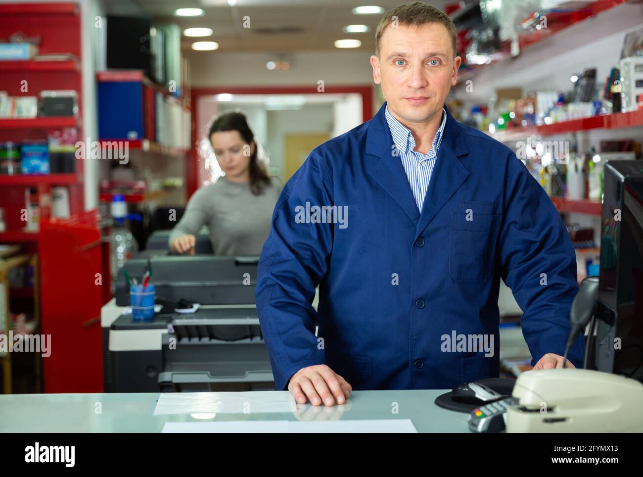 Male administrator of typography hospitably meeting clients at ...