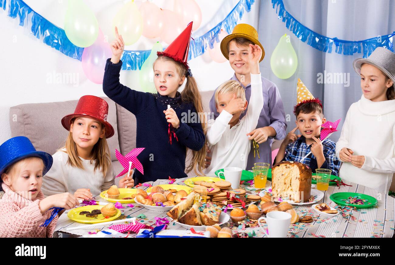 Happy children having fun during friend’s birthday party Stock Photo ... Happy children having fun during friend’s birthday party Stock Photo ...