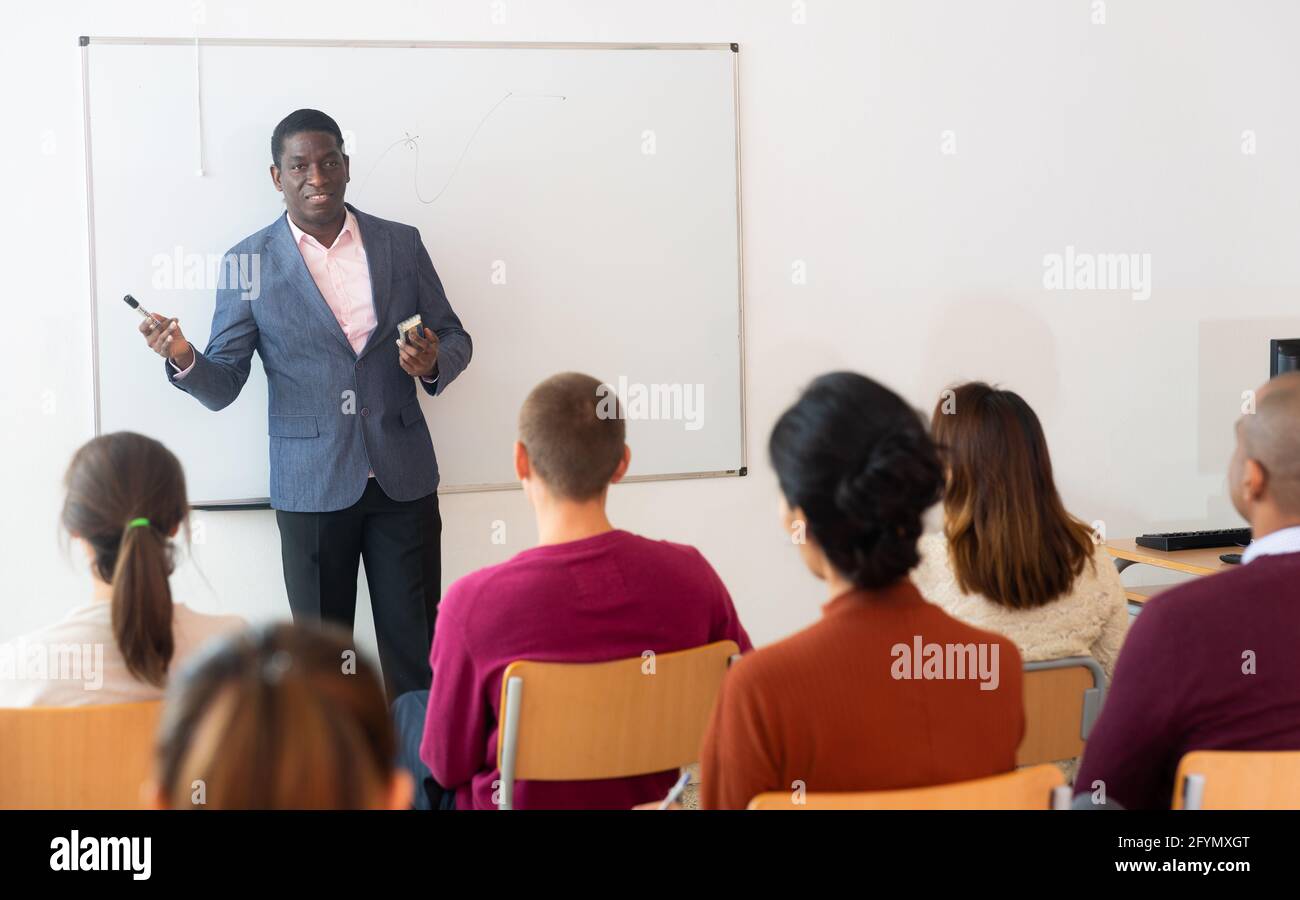 African american male teacher lecturing to adult students Stock Photo ...