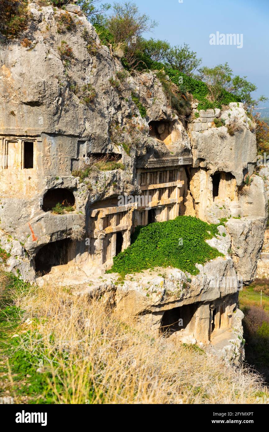 View of antique rock burial chambers in ancient Lycian city of Tlos in ...