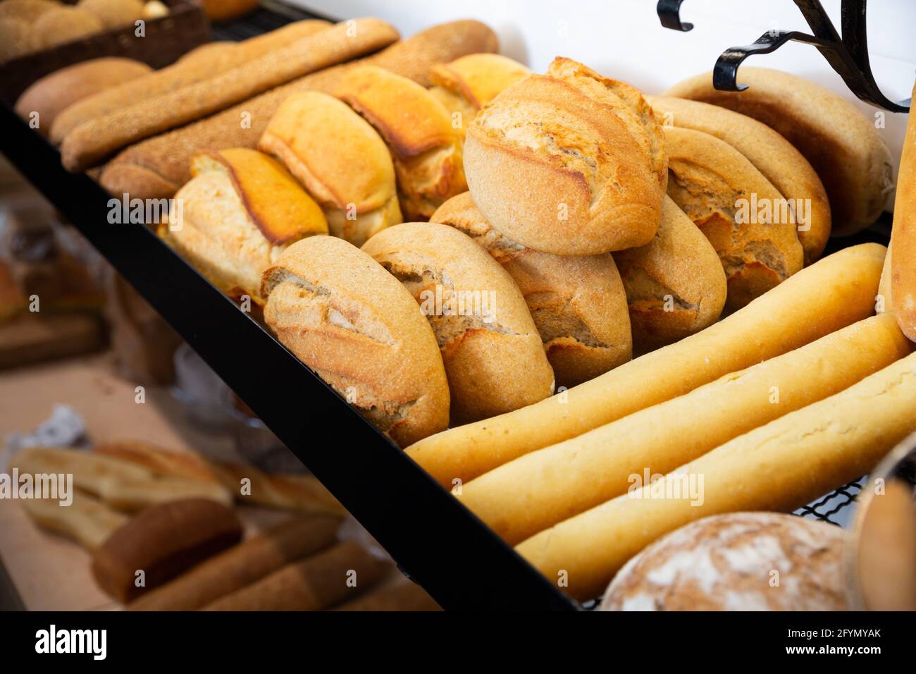 Interior of traditional Spanish bakery shop with showcase full of fresh ...