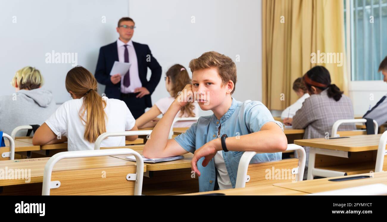 Portrait of a tired student in school class Stock Photo - Alamy