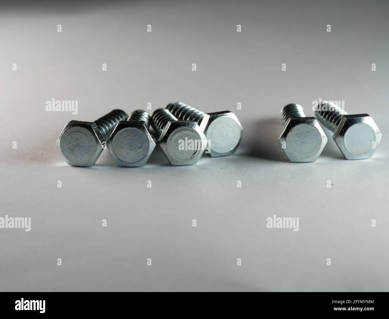 Closeup shot of screws on a white surface Stock Photo - Alamy