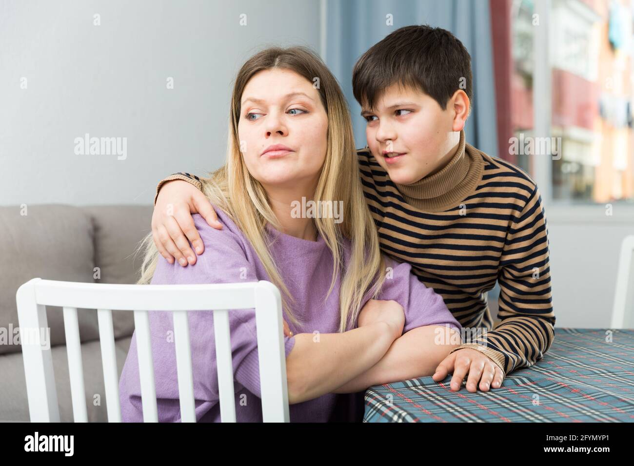 Son wants to make peace with his mother after arguing at home Stock ...