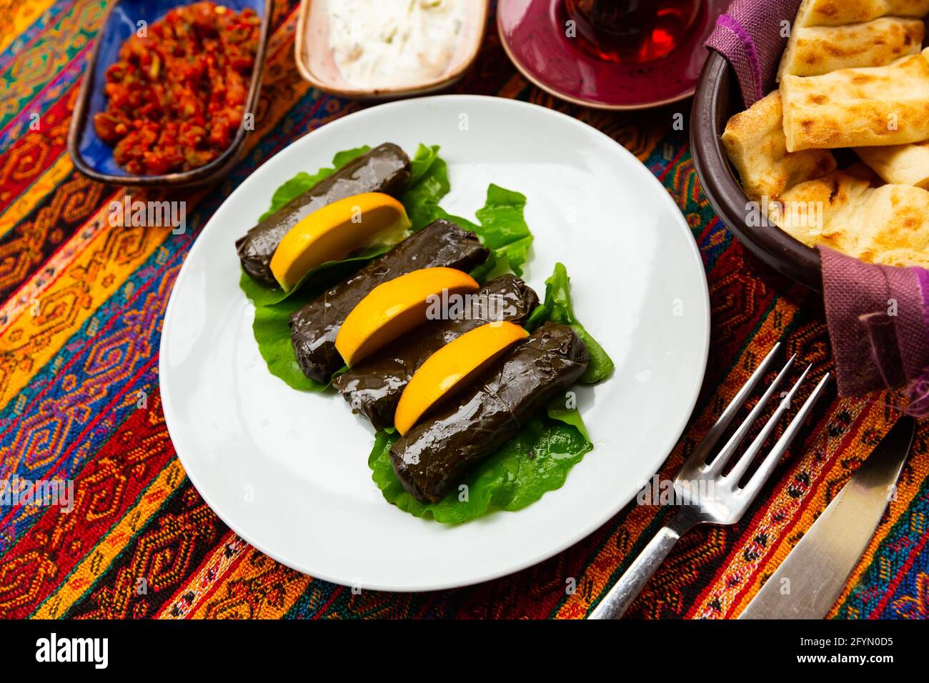 Traditional Turkish sarma from vine leaves filled with rice served with ...