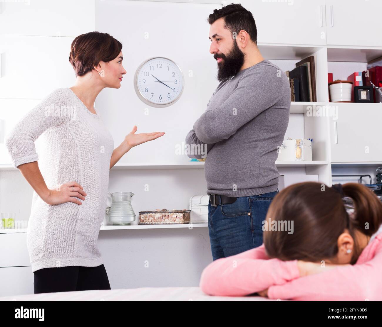 Parents arguing with teenager listening hi-res stock photography and ...