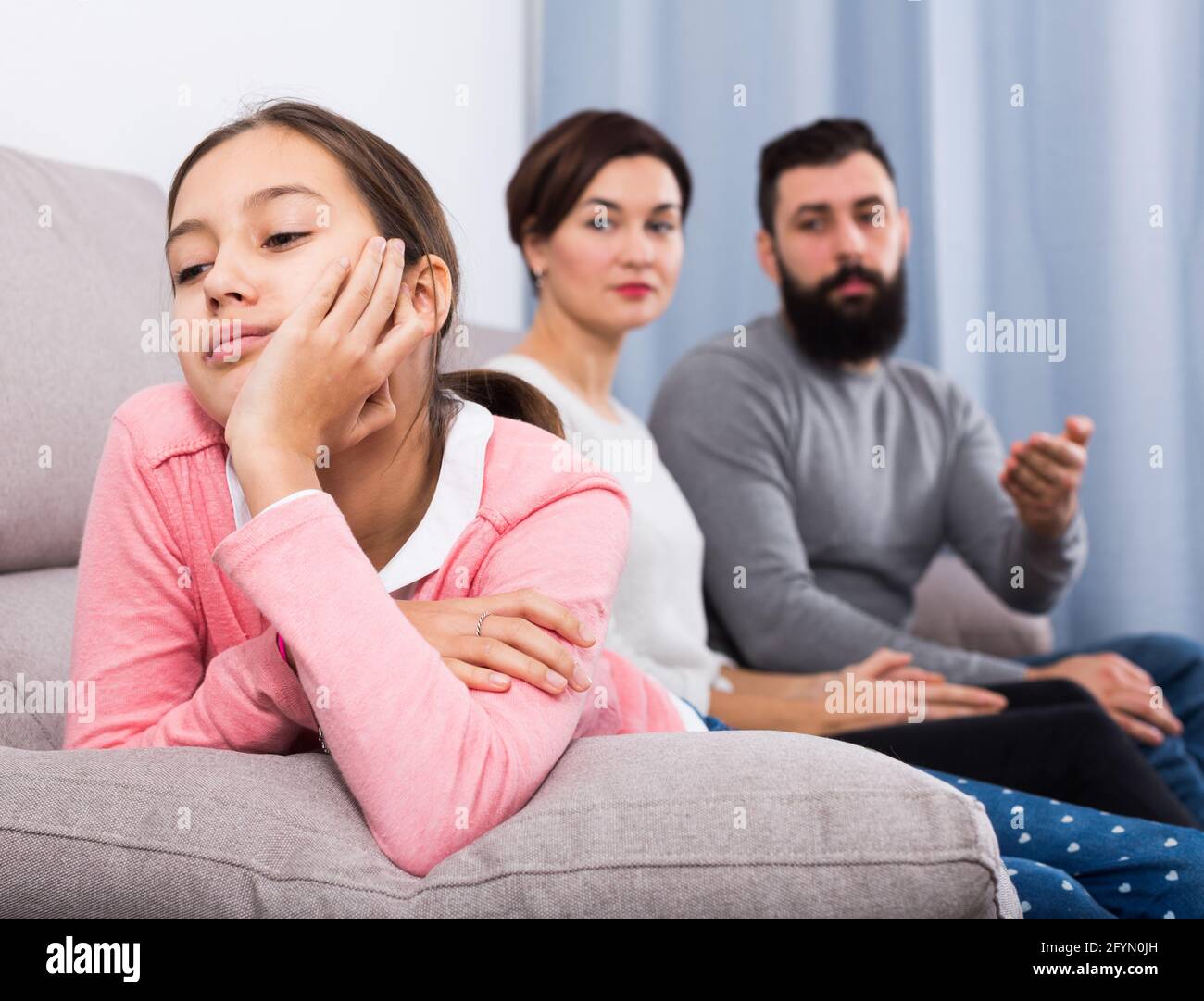 Young father and mother correcting their child for disobedience Stock ...
